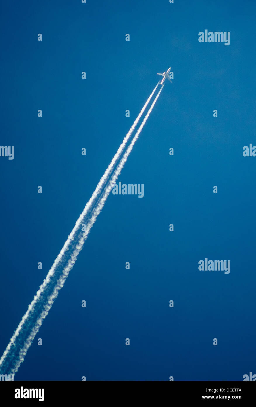 Contrail In The Dark Blue Sky, A Beautiful Show Stock Photo - Alamy
