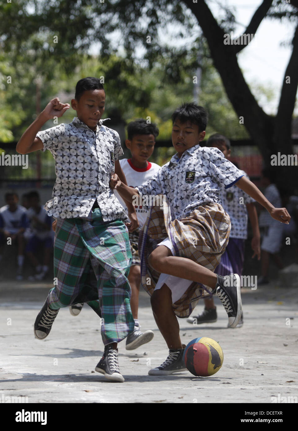 Solo, Java, Indonesia. 16th August 2013. Group of students playing ...