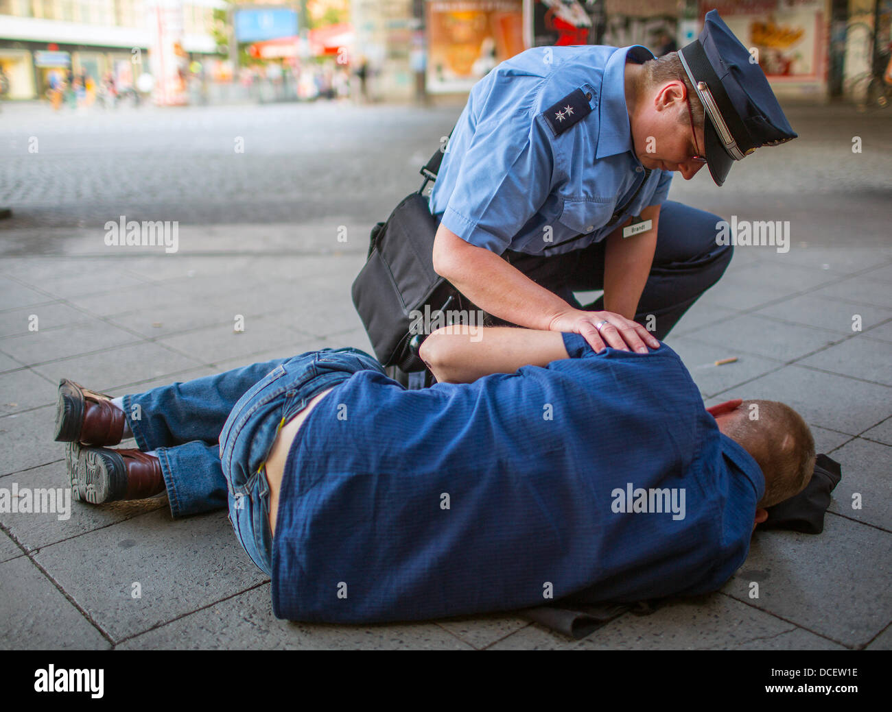 Police officer Sigrid Brandt tries to wake up Polish homeless Marek on ...