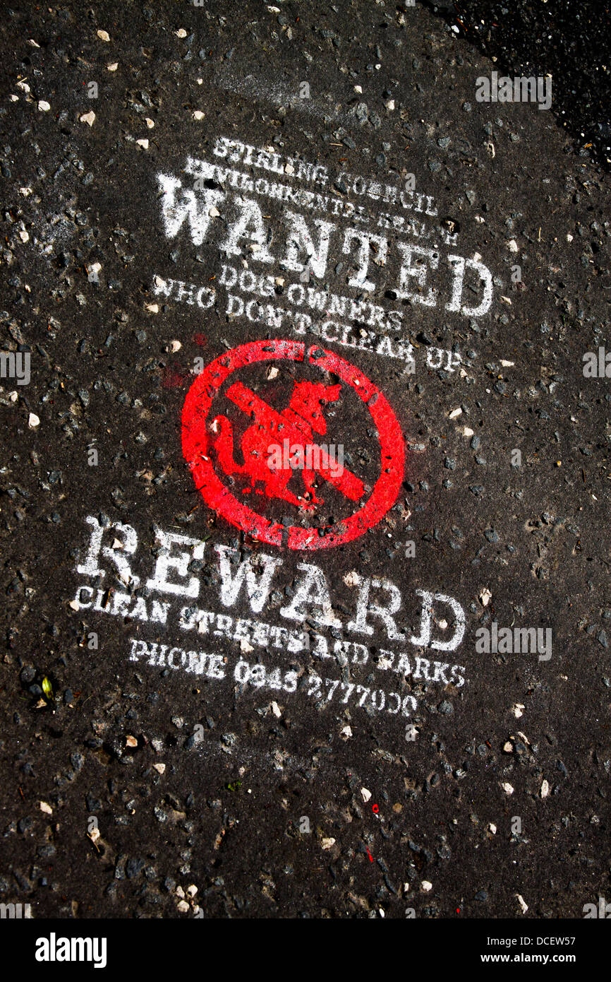 Dog poo clean up warning sign stencilled on tarmac Stock Photo - Alamy
