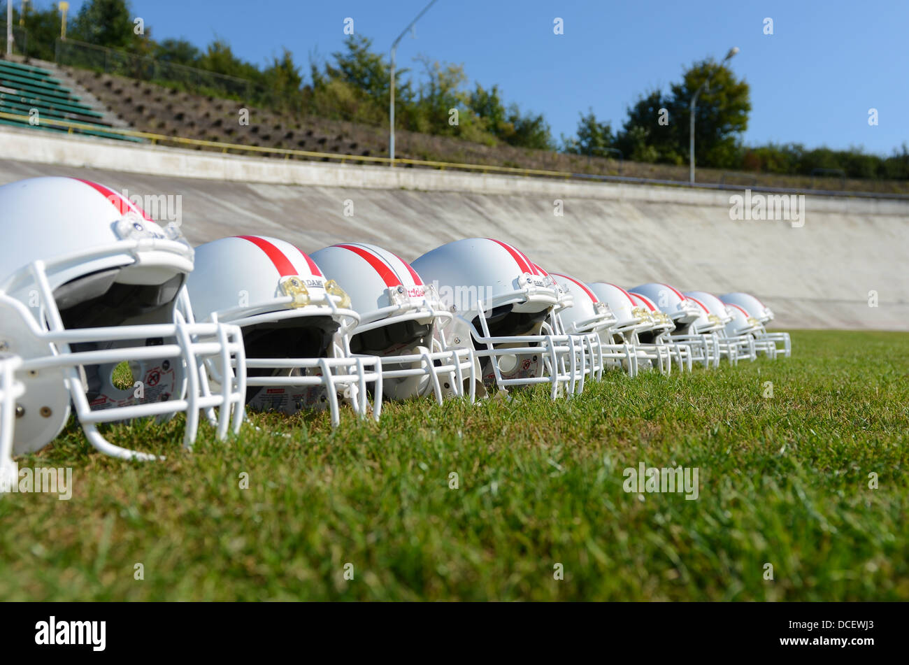 Line of American Football Helmets on Field Stock Photo - Alamy