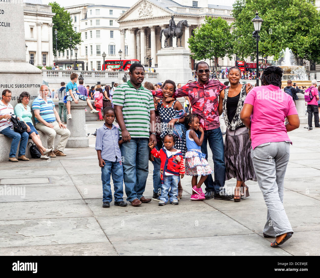 Family poses for photo in Trafalgar Square Stock Photo - Alamy