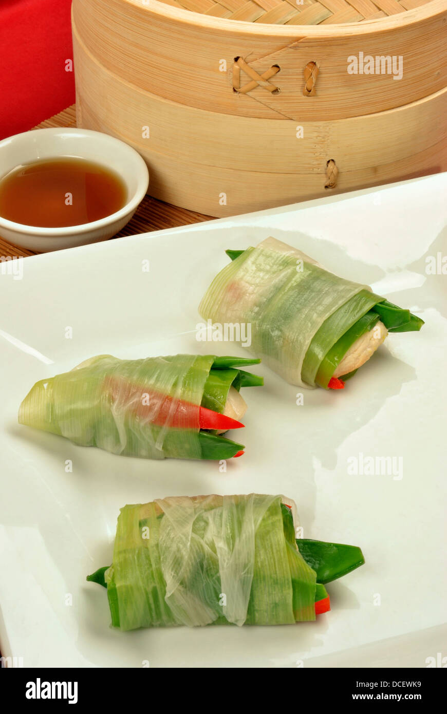 asian style chicken and vegetable bundles Stock Photo - Alamy