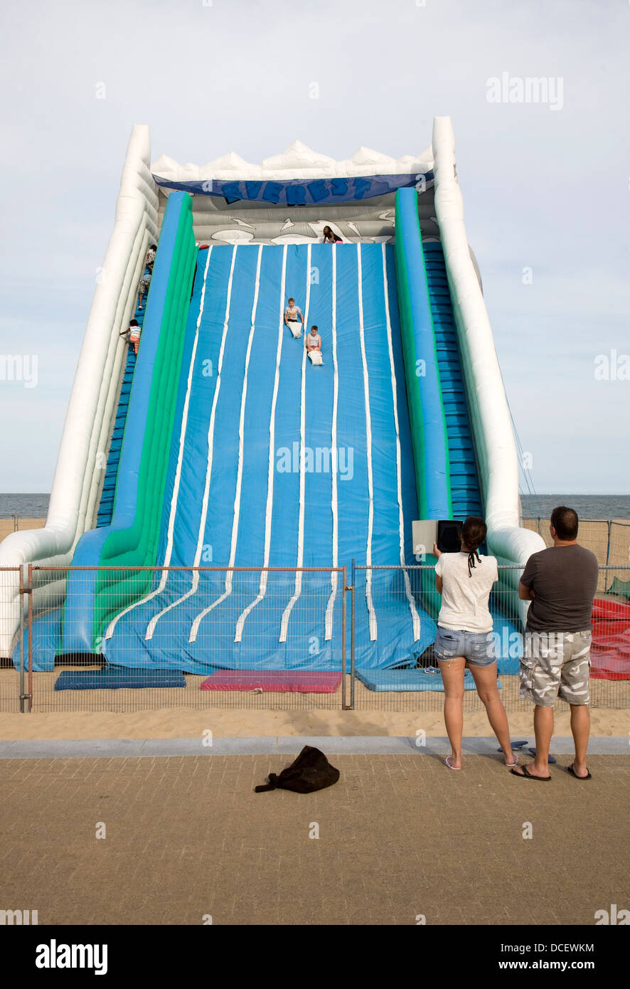 Children play on giant inflatable slide Great Yarmouth, Norfolk ...