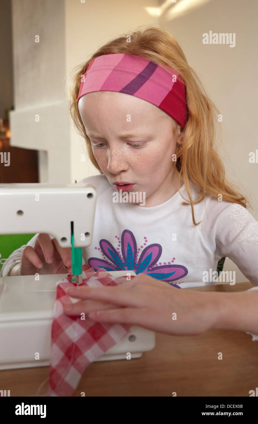 Child girl sewing machine hi-res stock photography and images - Alamy