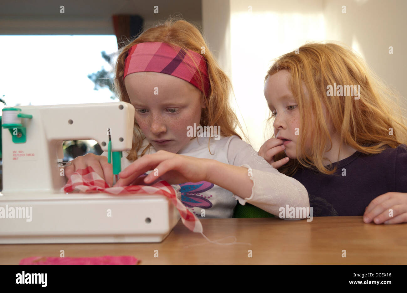 Child girl sewing machine hi-res stock photography and images - Alamy