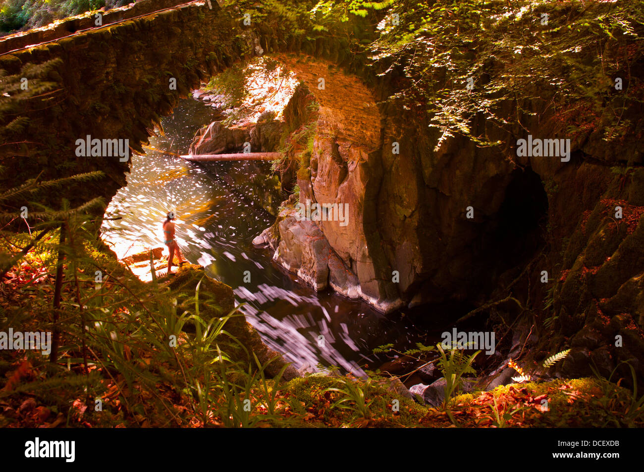 Dreamy river under arched bridge Stock Photo - Alamy