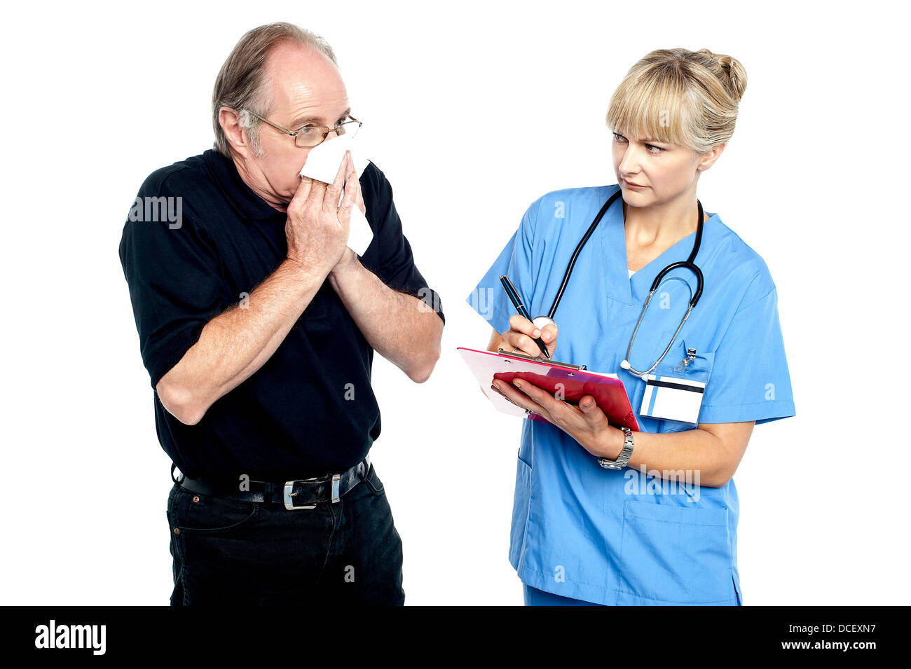 Aged male suffering from cold, sneezing. Female doctor looking at him ...
