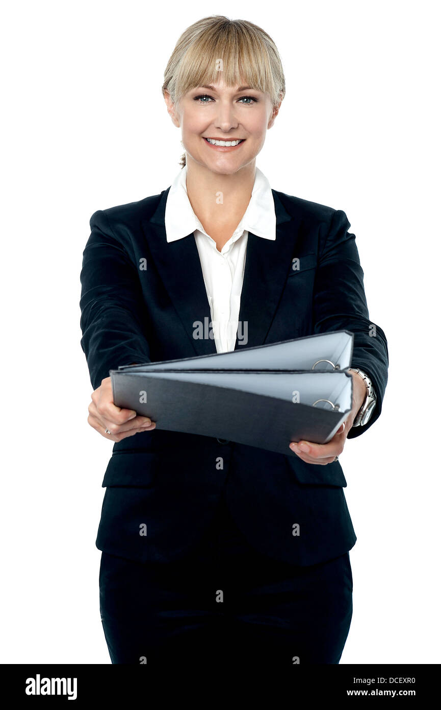 Stylish employee handing over the documents to her boss Stock Photo - Alamy