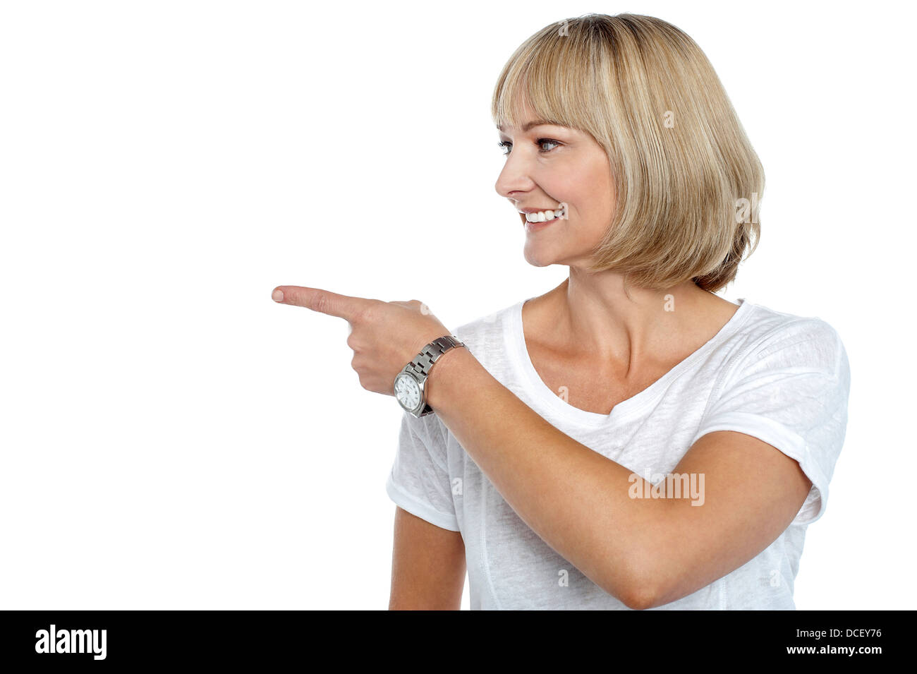 Woman in casuals pointing sideways. All against white background Stock ...