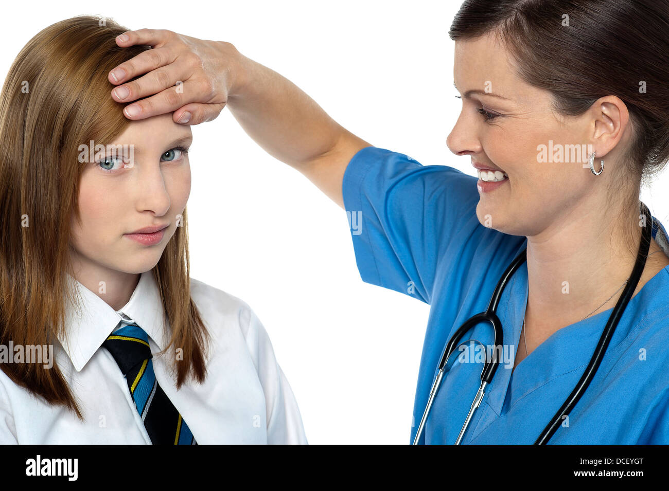 Doctor placing her hand on a patients forehead. Symptoms of fever Stock ...