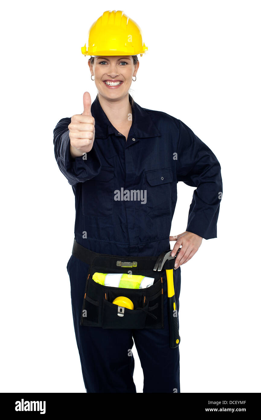 Keep up the good work. Confident lady worker showing thumbs up to you ...