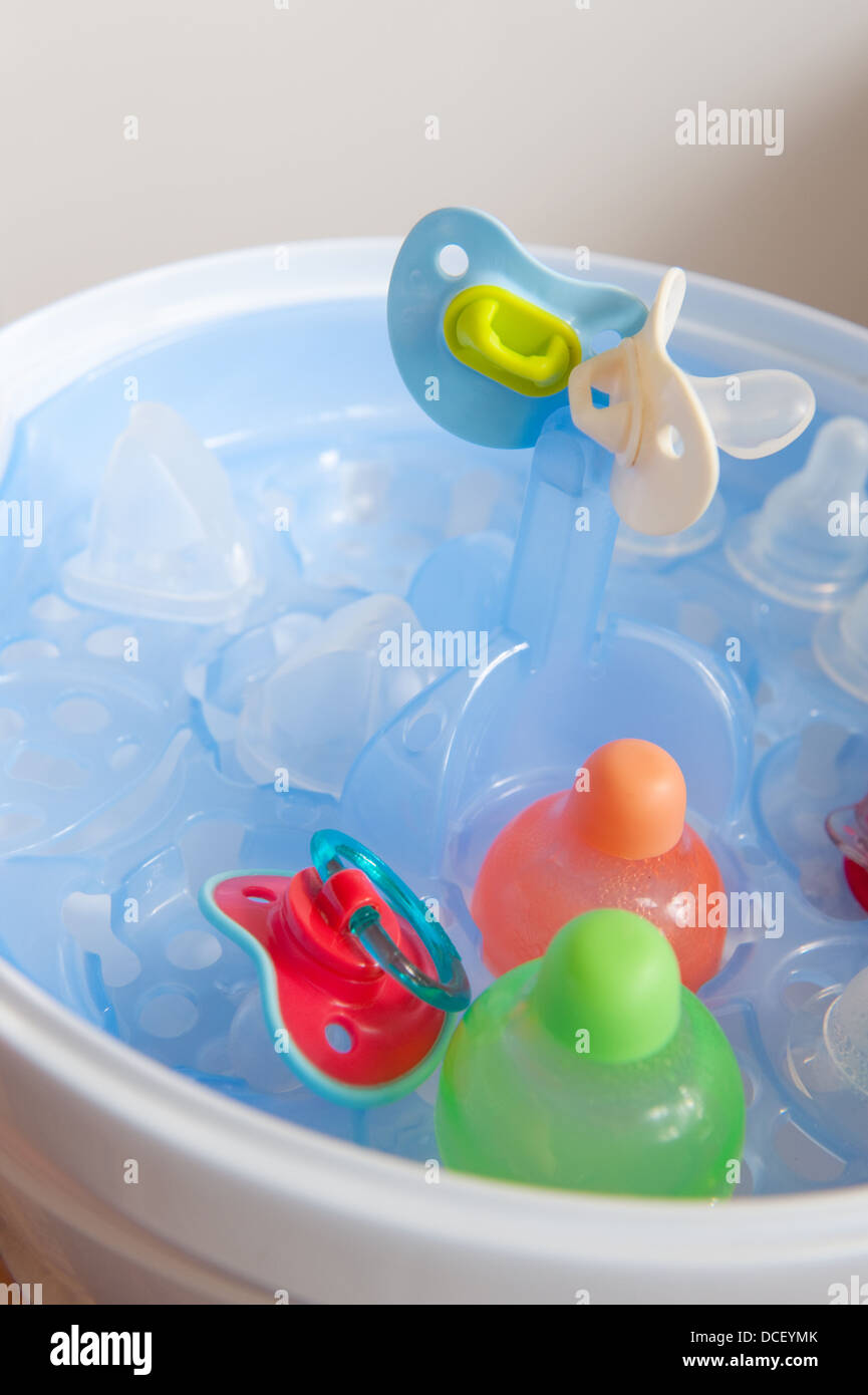cleaning the baby bottles Stock Photo - Alamy