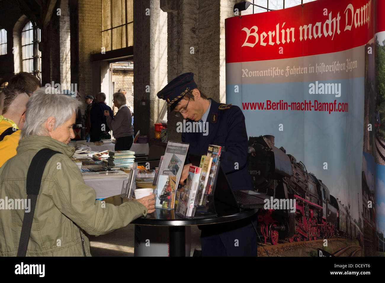 Railway worker sells the steam train Stock Photo - Alamy