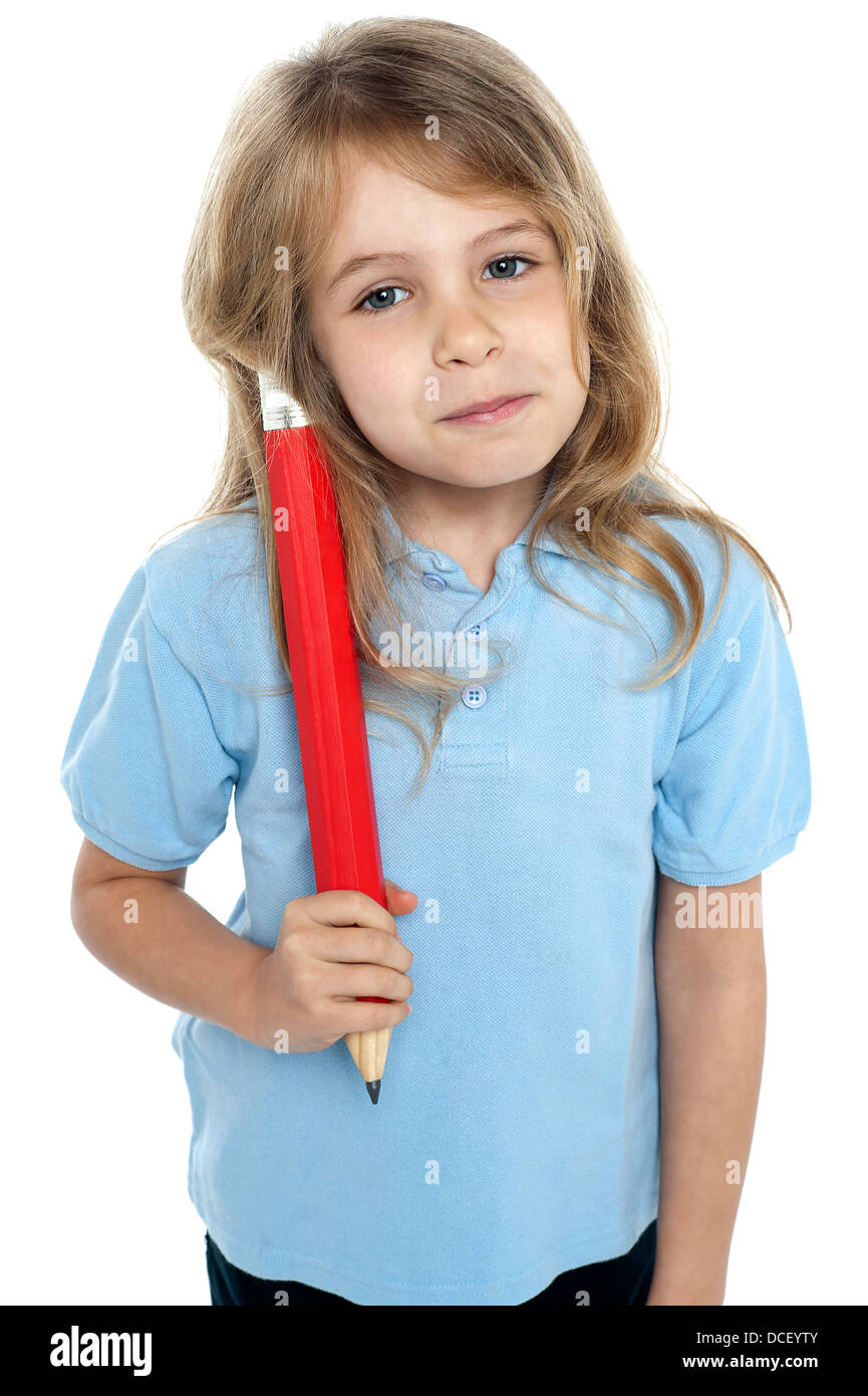 Casual kid with straight face expression looking at camera Stock Photo ...