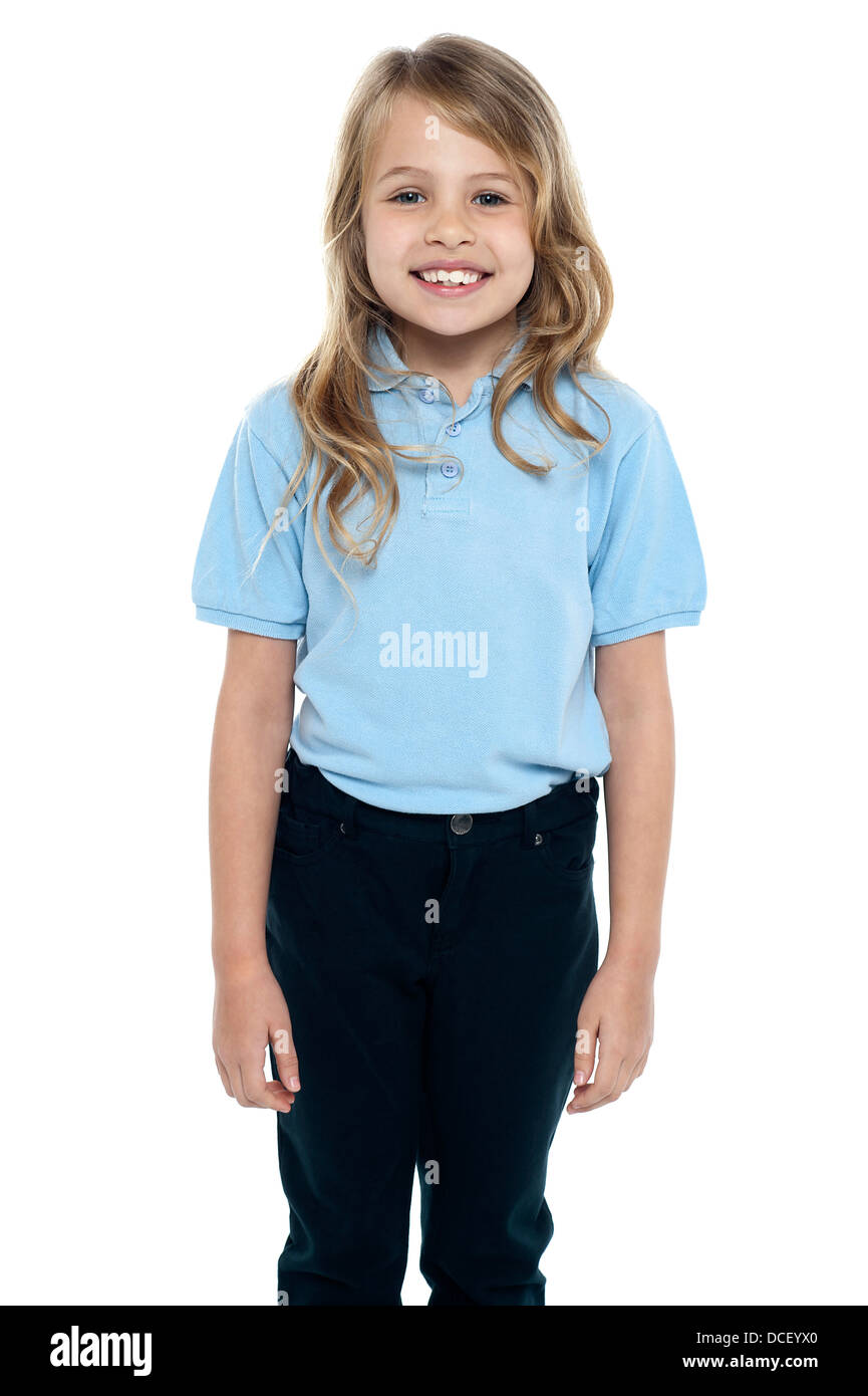 Isolated charming young girl posing with confidence, smiling warmly ...