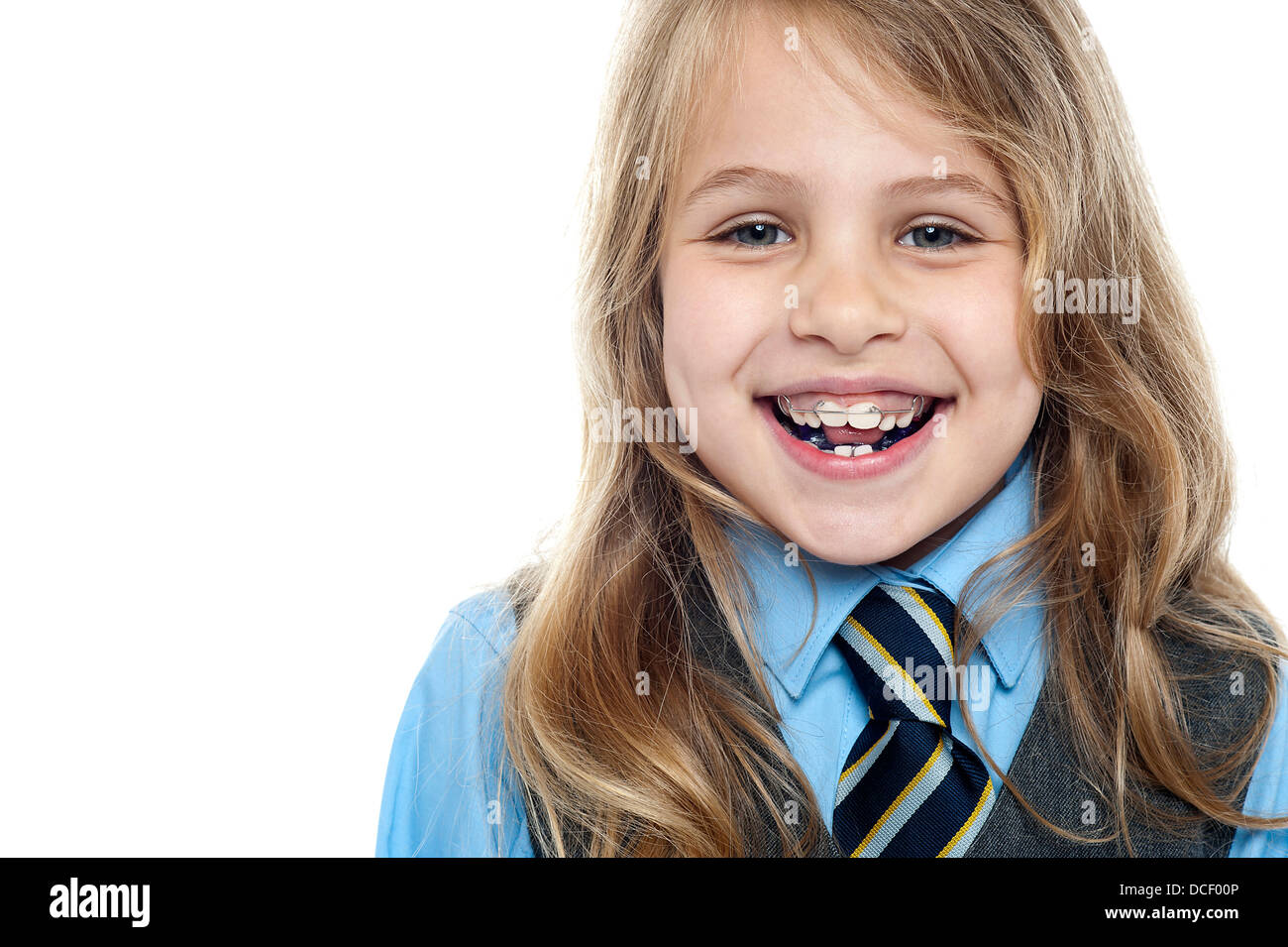 Pretty elementary school girl posing cheerfully. Closeup shot Stock ...