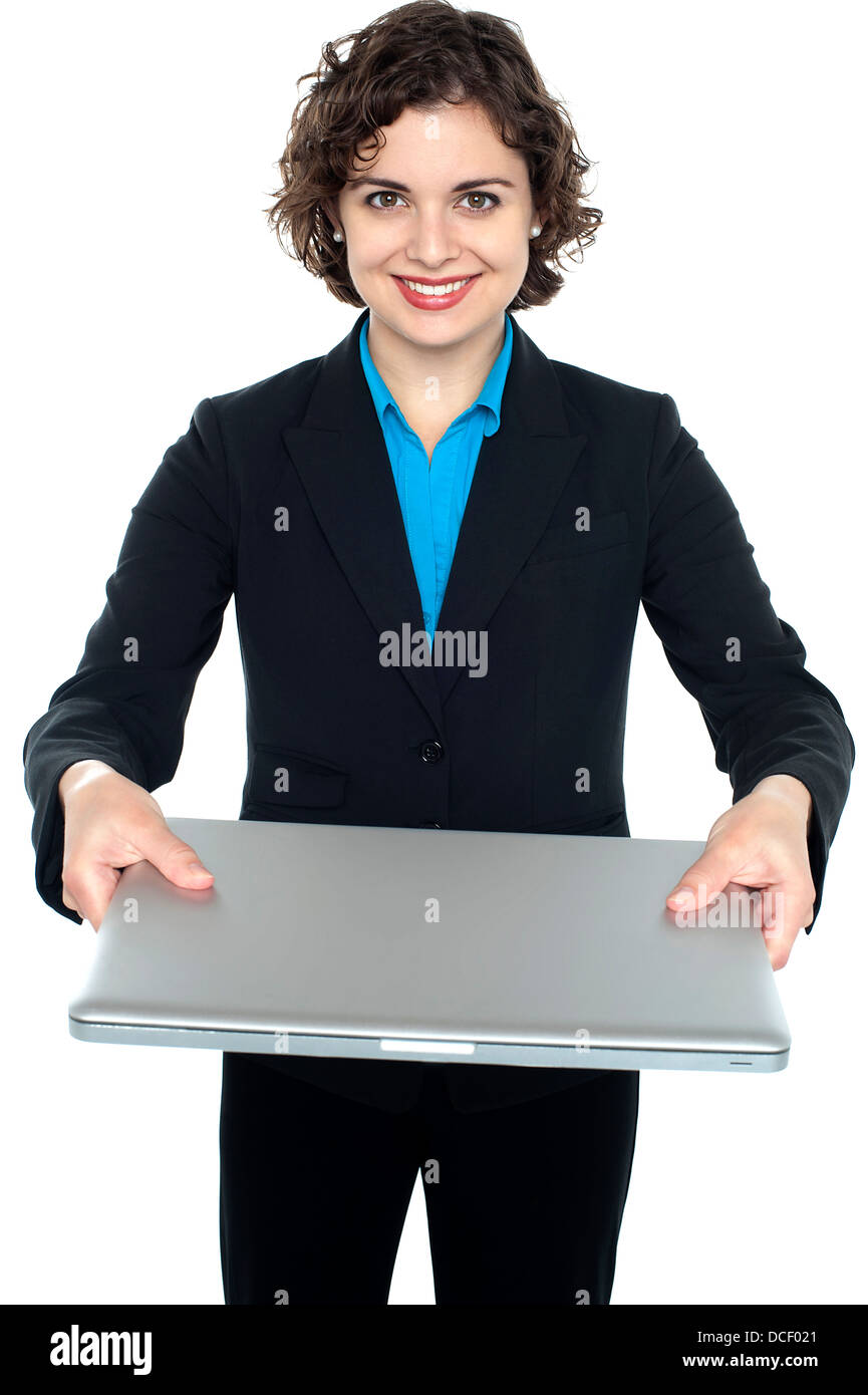 Attractive executive showcasing her brand new laptop, white background ...