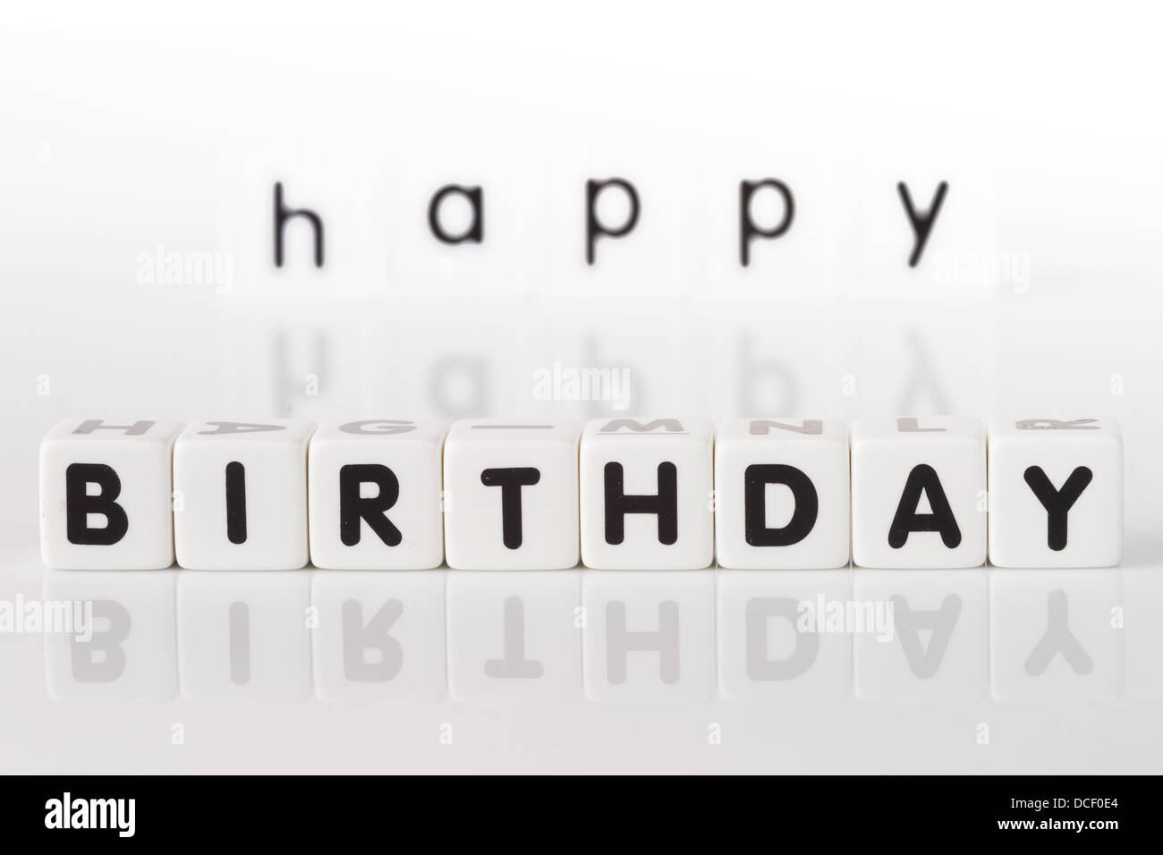 Happy Birthday spelled in game letters with reflection isolated on ...