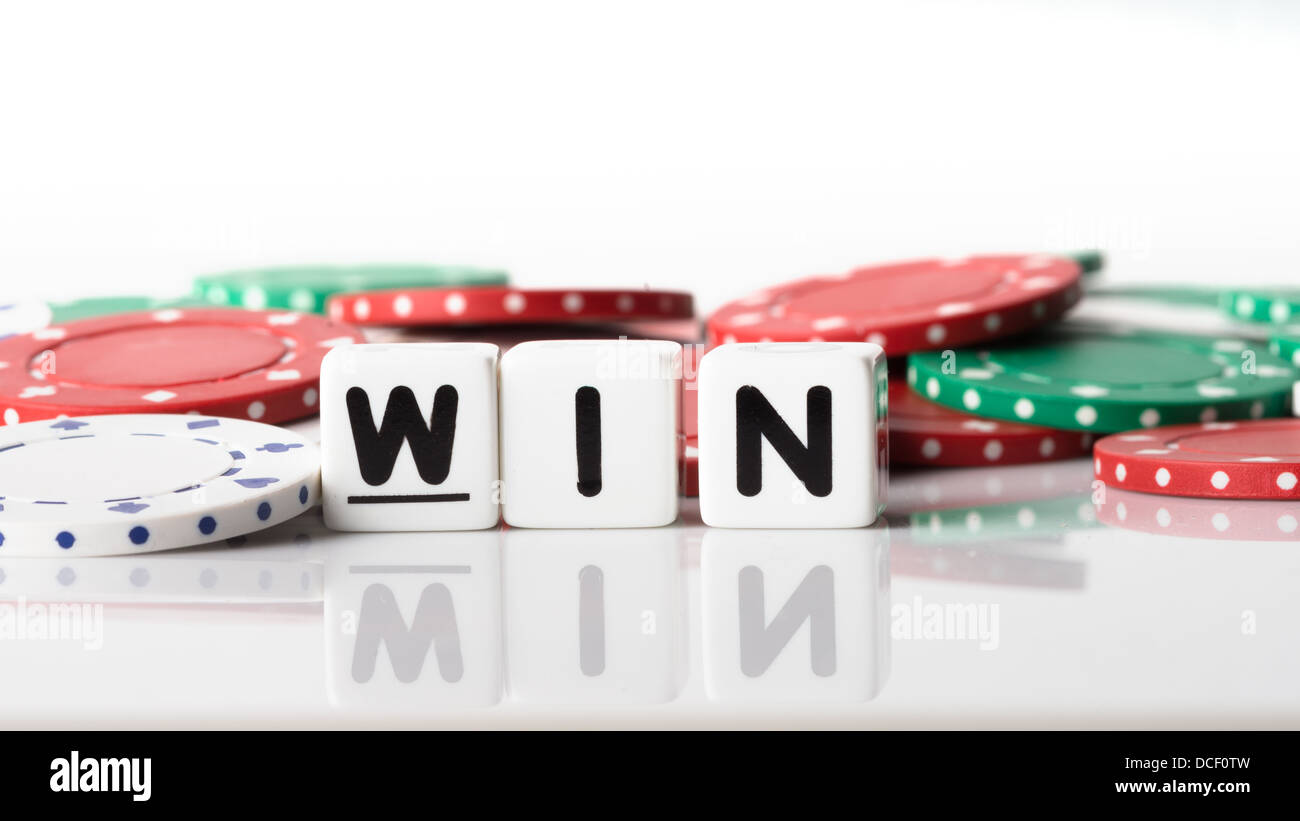 Win spelled in dice letters reflected on white isolated background with ...