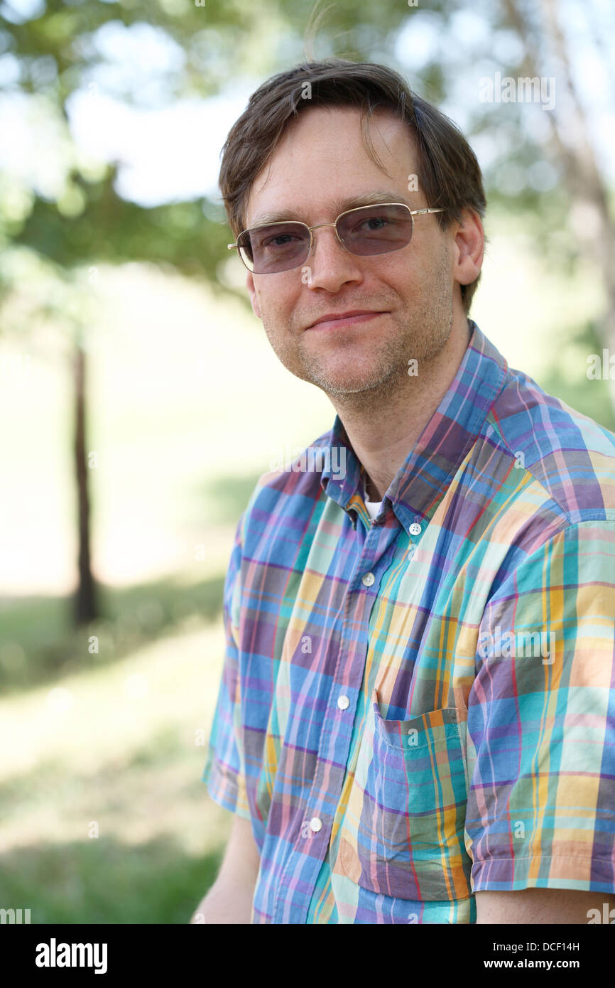 Smiling man enjoying outdoors Stock Photo - Alamy