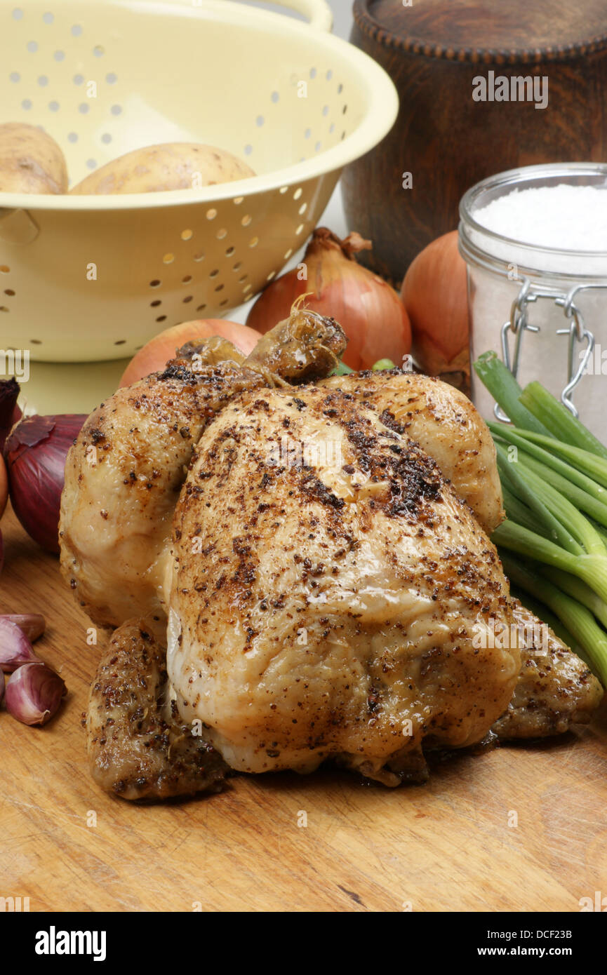 one grilled chicken with some organic vegetable Stock Photo - Alamy