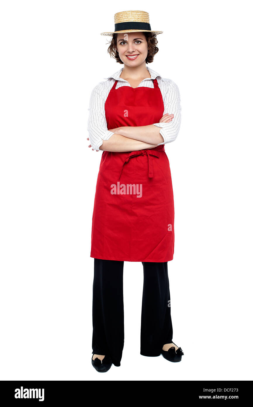 Portrait of young woman wearing apron, full length studio shot Stock ...