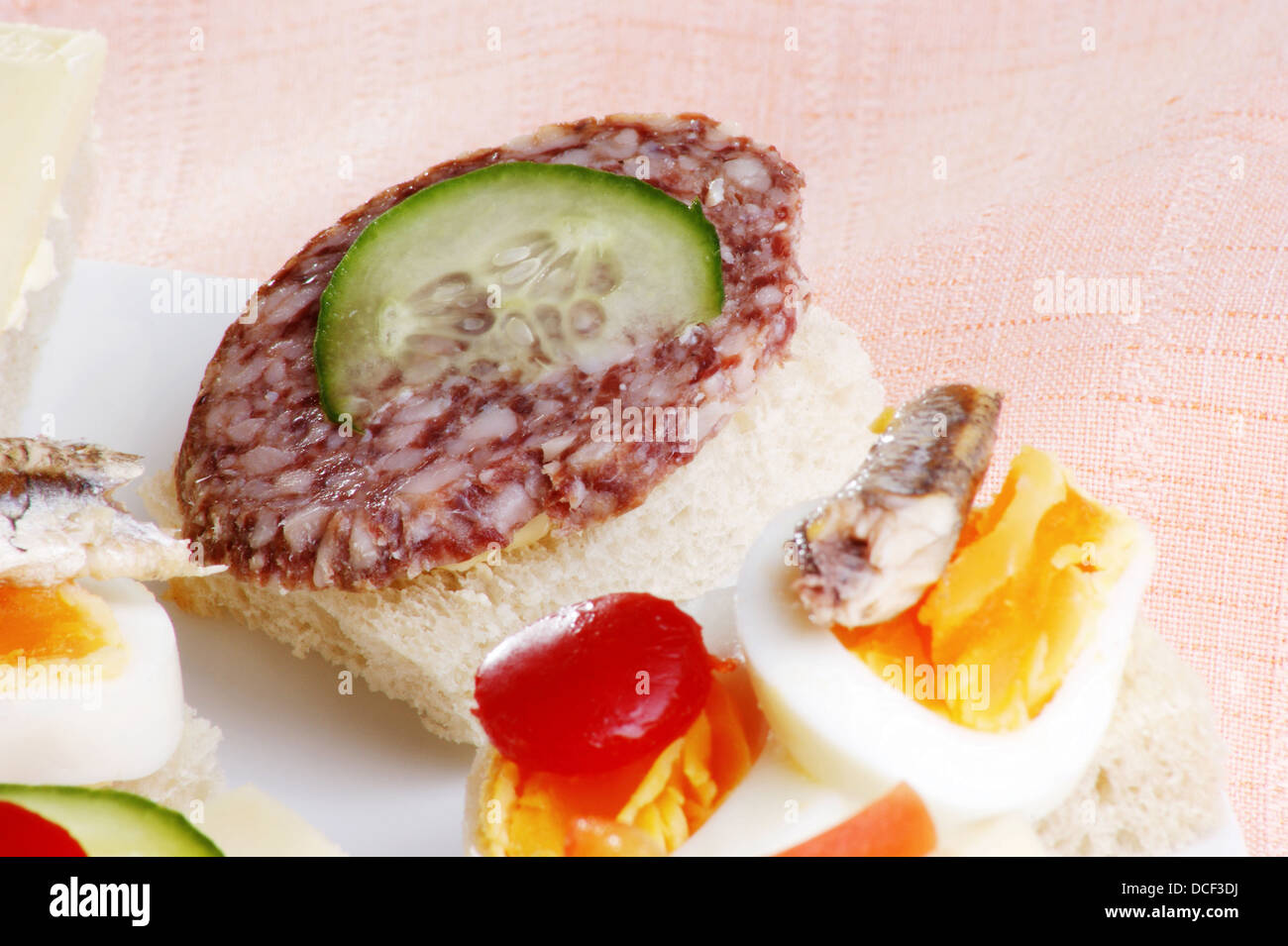 some party nibbles on a white plate Stock Photo - Alamy