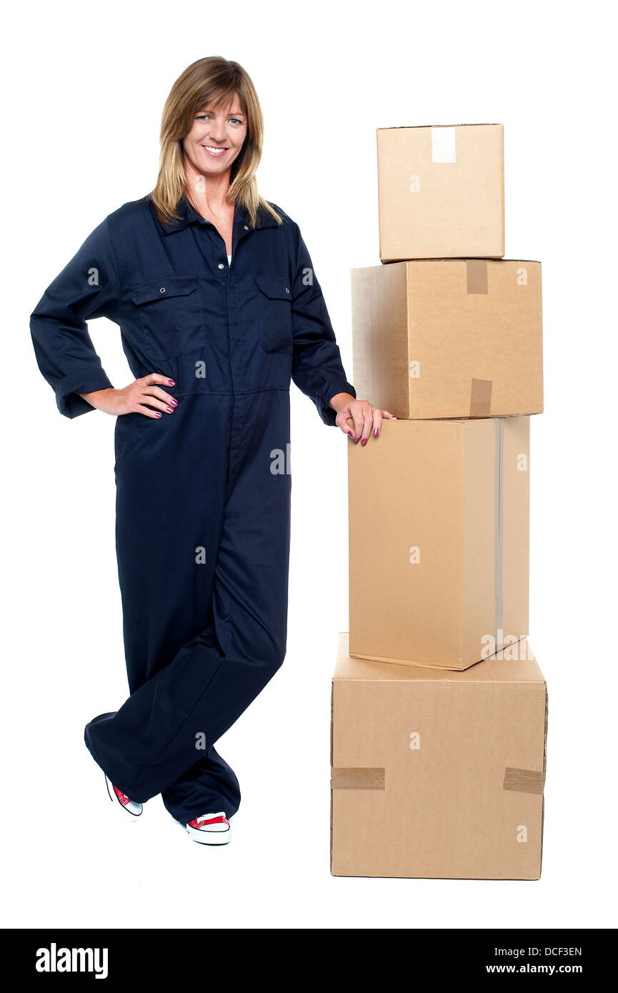 Full length portrait of delivery woman in uniform striking stylish pose ...