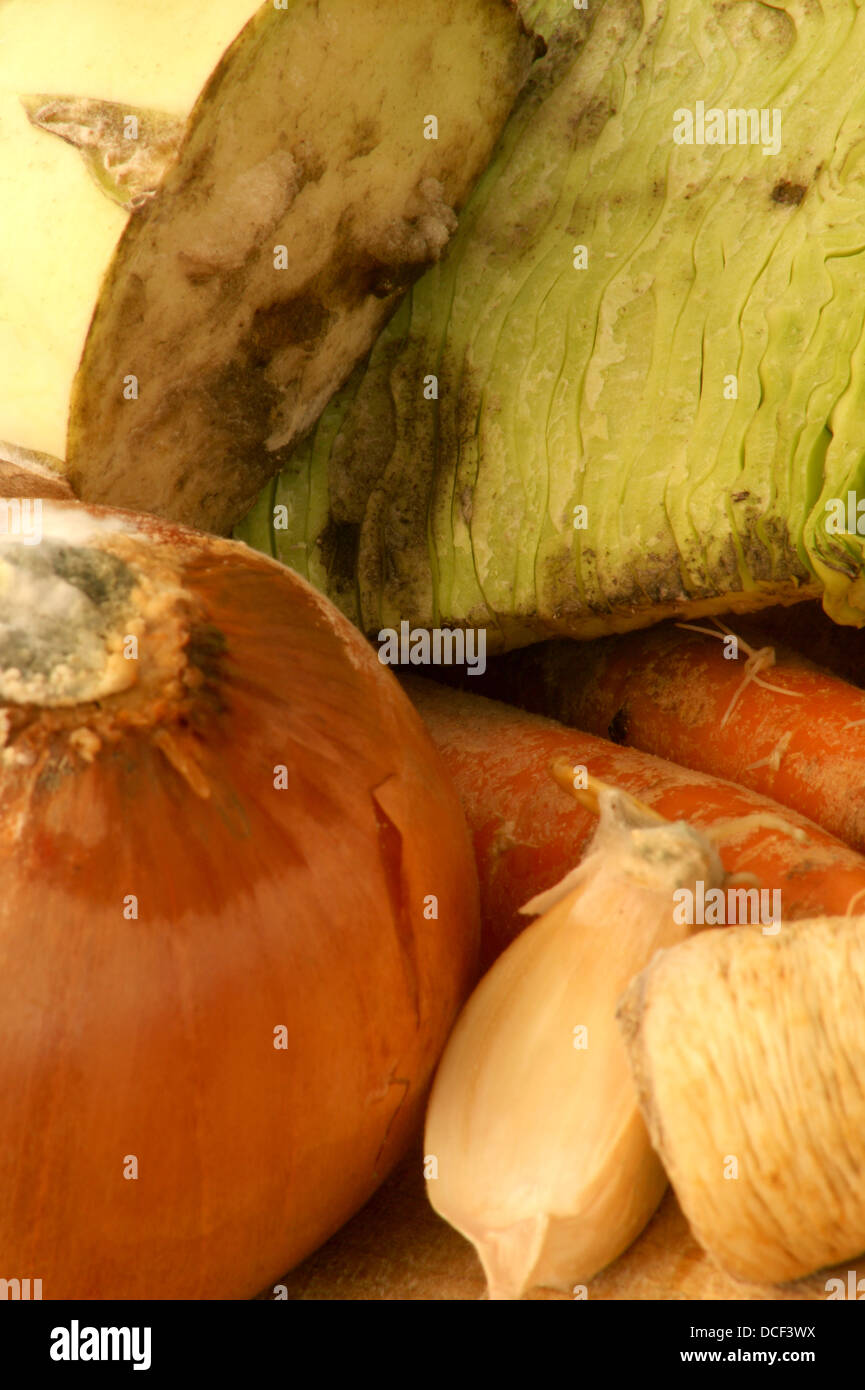 mouldy organic vegetable unhealthy to eat on a timber board Stock Photo ...