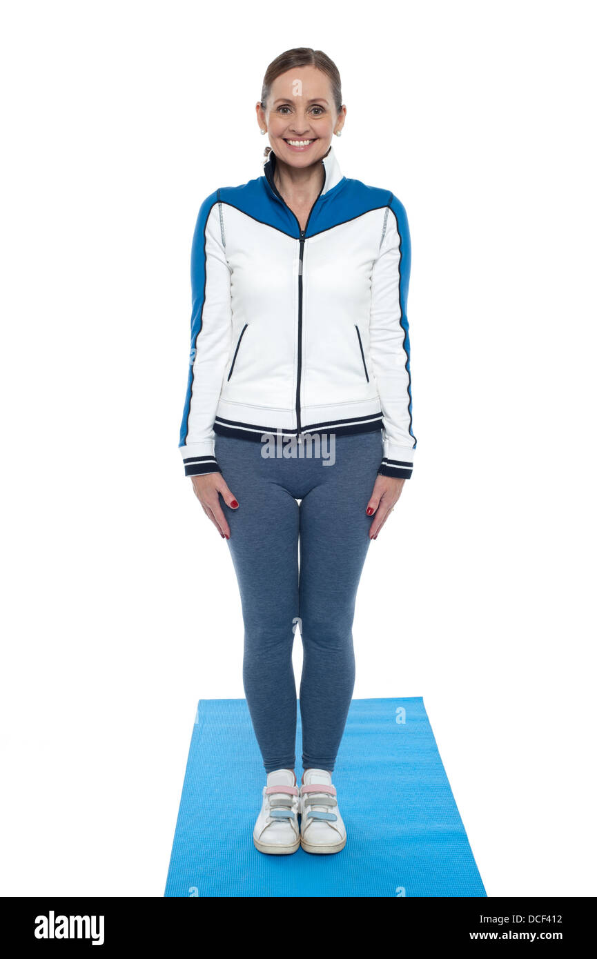 Active female posing just before her workout session, wearing track ...