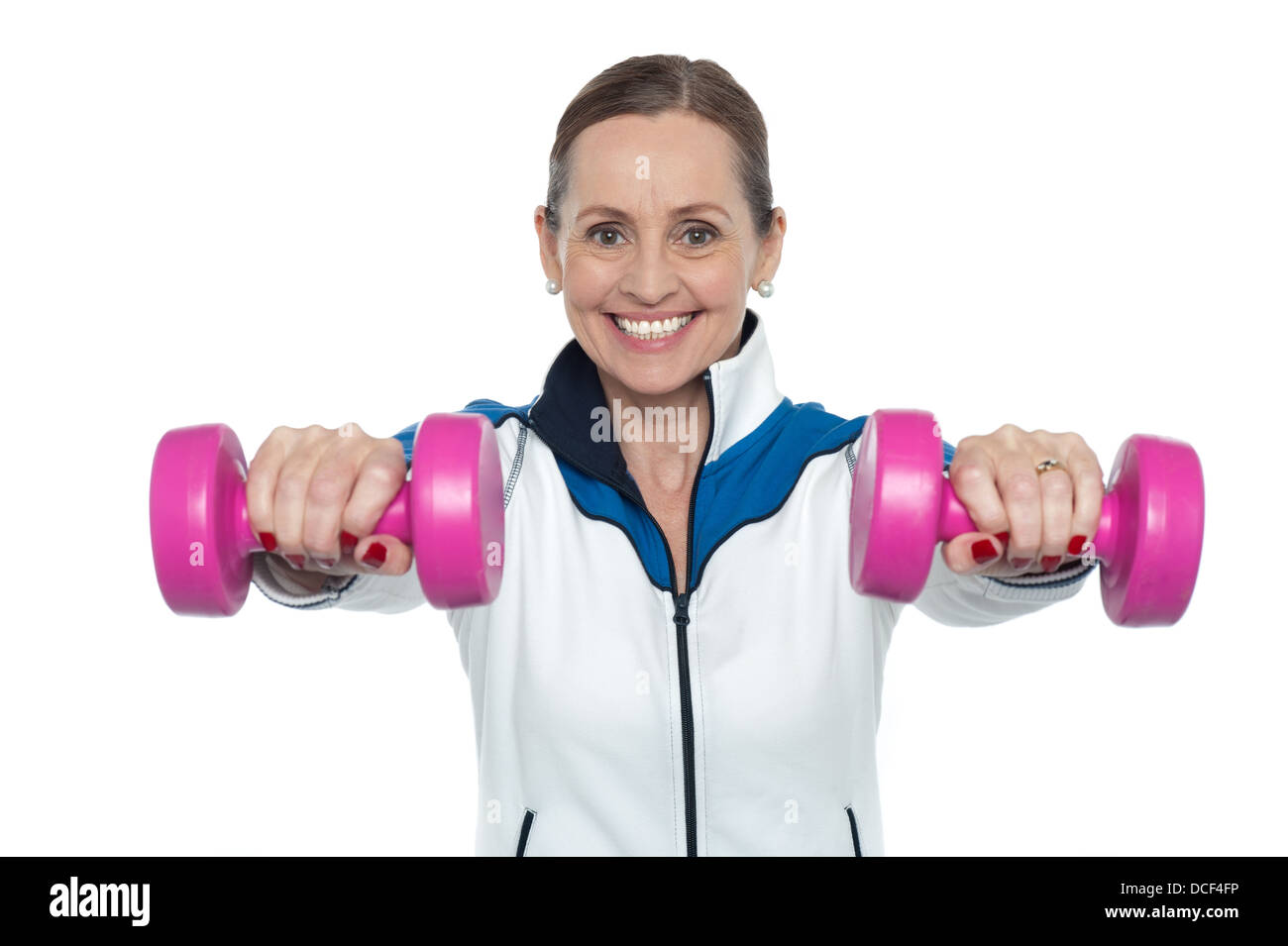 Female working out with pink dumbbells. Arms outstretched Stock Photo ...