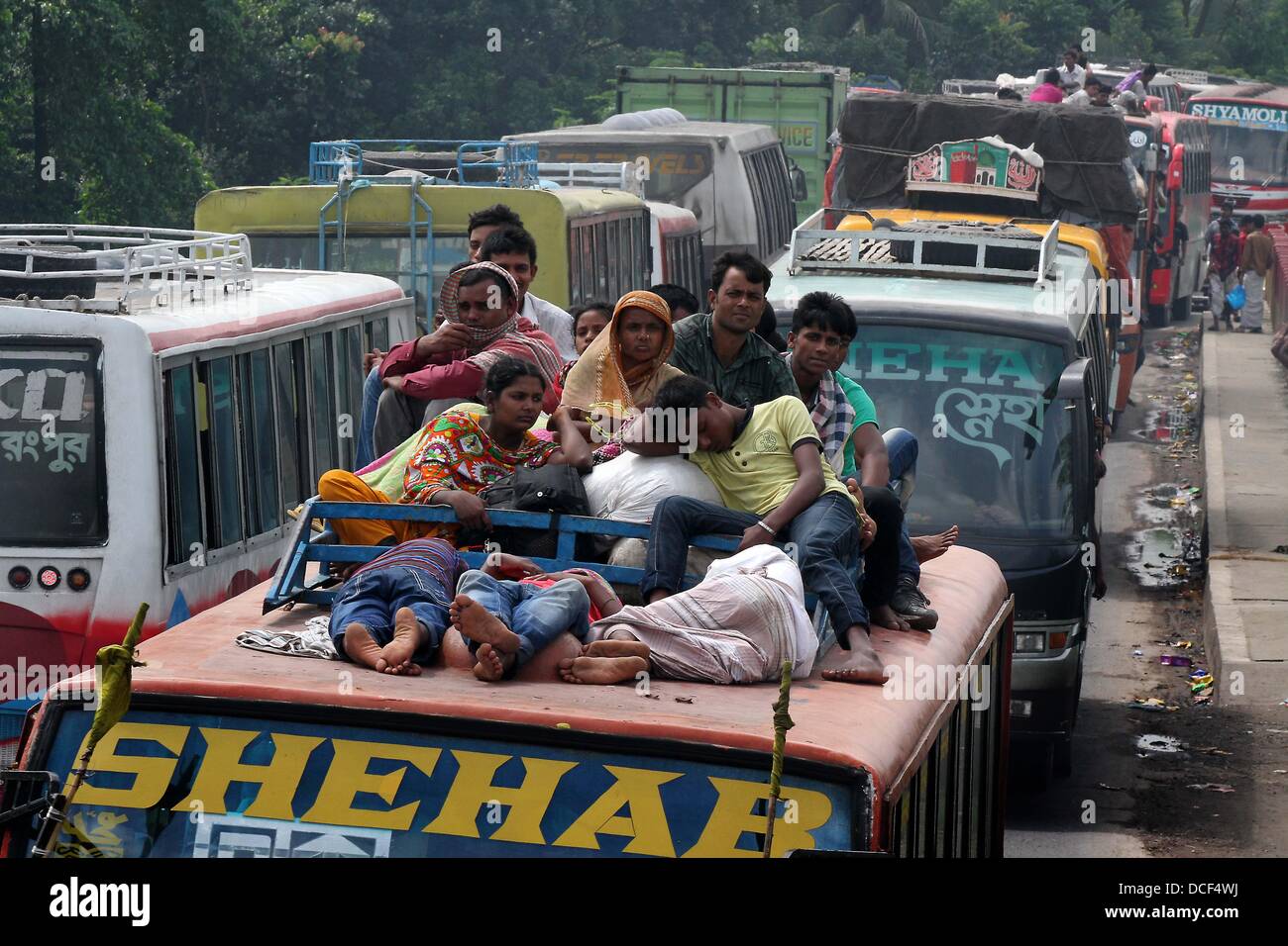 BANGLADESH, Dhaka: City dwellers back in the capital stand on the top ...
