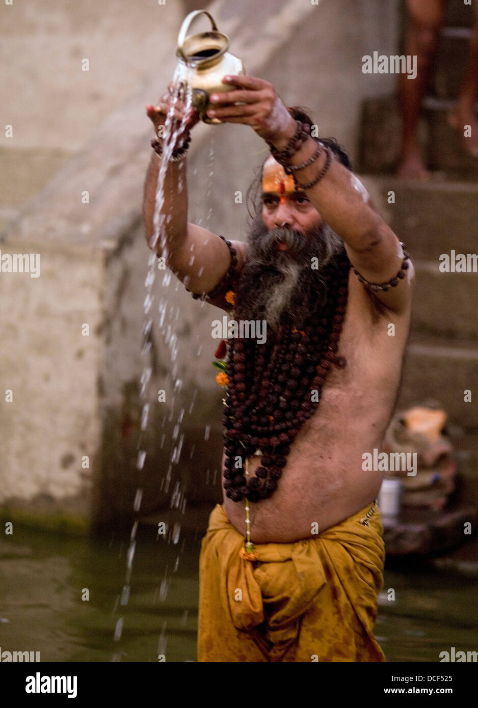 A Sadhu Pouring Libations Into The Ganges; The Ganges River,Varanasi ...