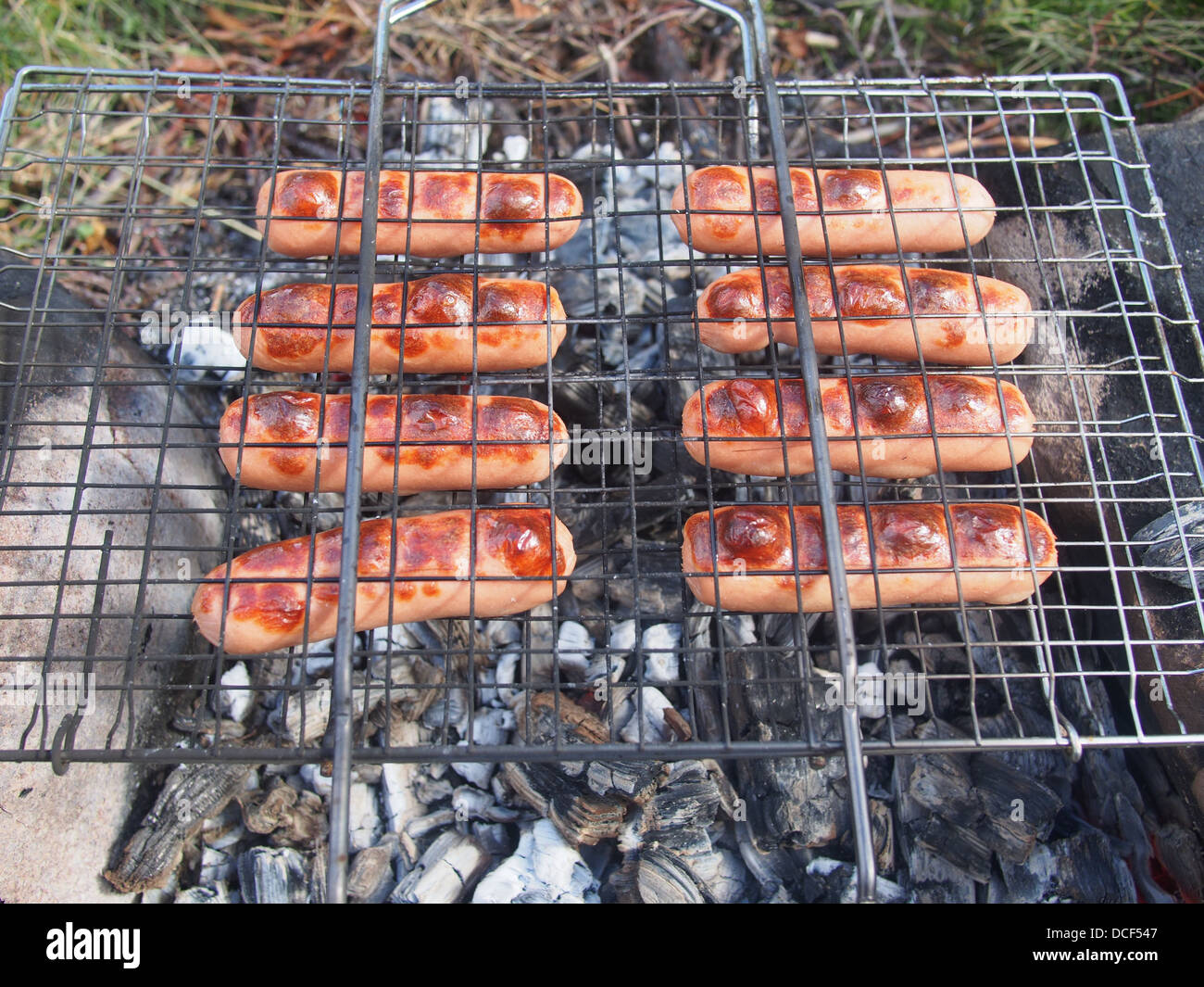 sausages on the fire Stock Photo - Alamy