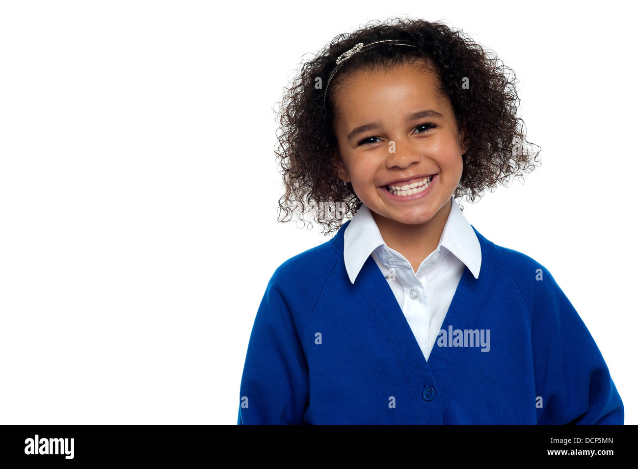 Happy elementary school girl flashing a smile isolated over white Stock ...