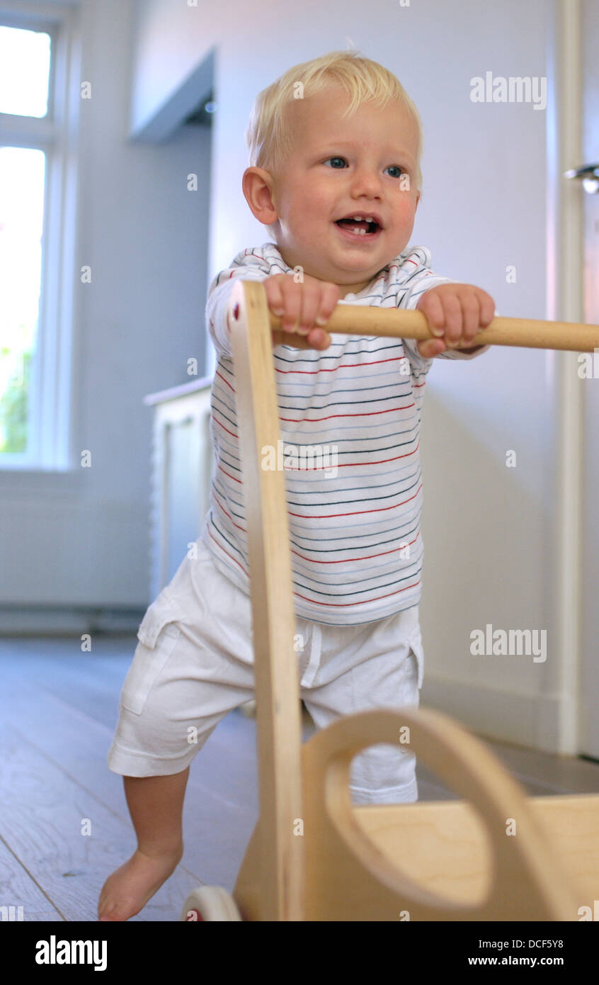 Toddler boy walking the room Stock Photo - Alamy