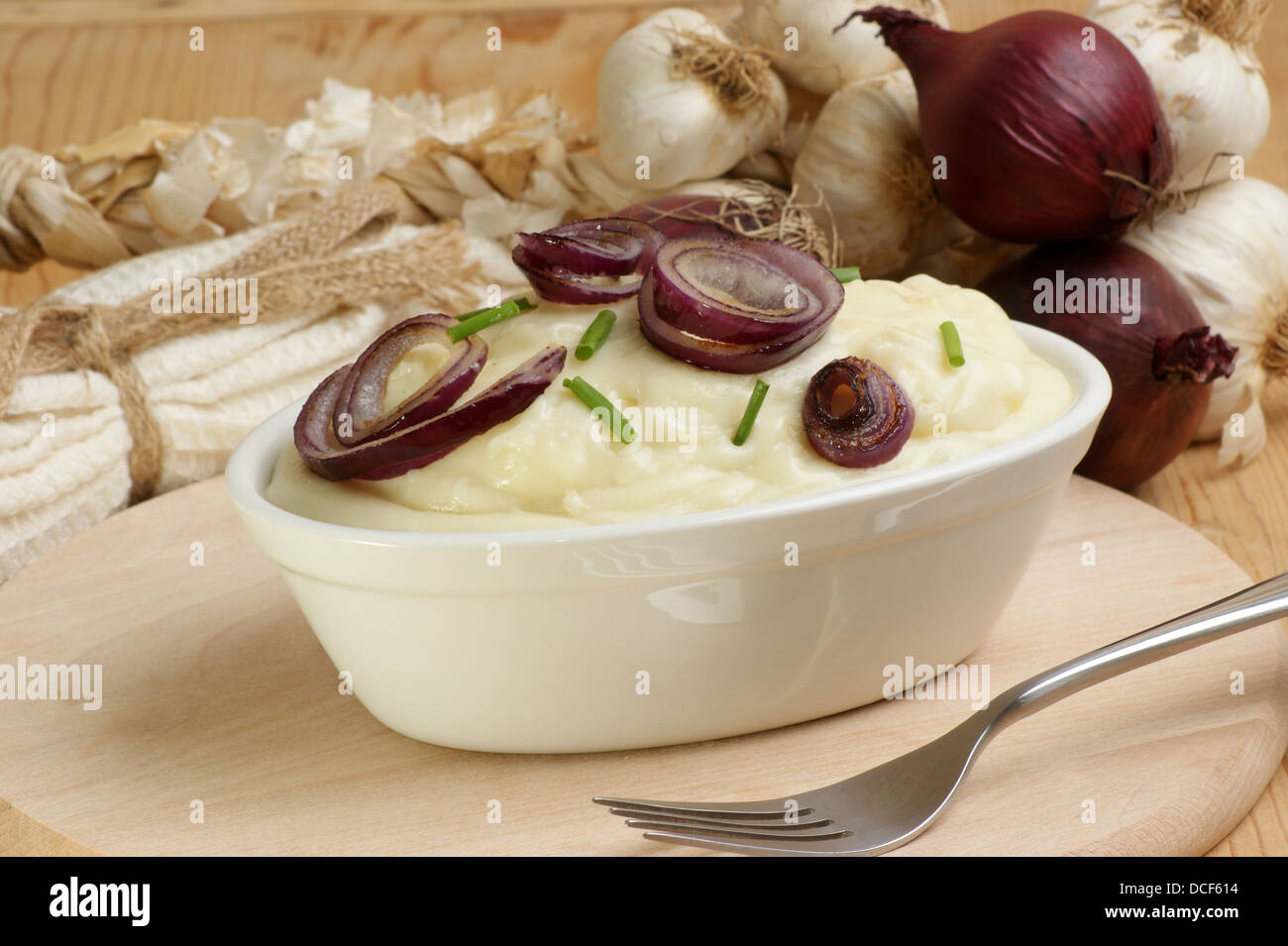 grilled onion rings with mash potato in a bowl Stock Photo - Alamy