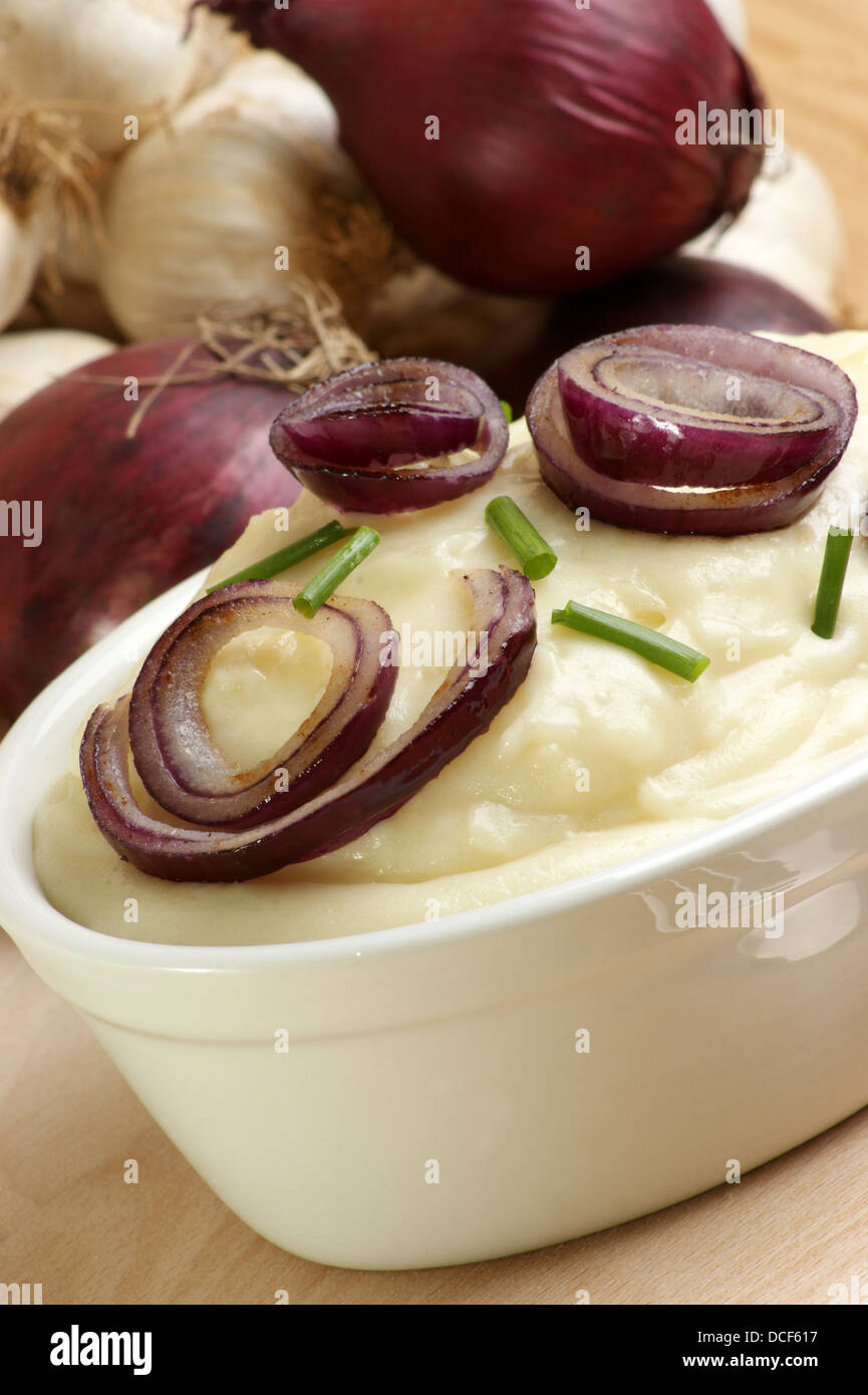grilled onion rings with mash potato in a bowl Stock Photo - Alamy