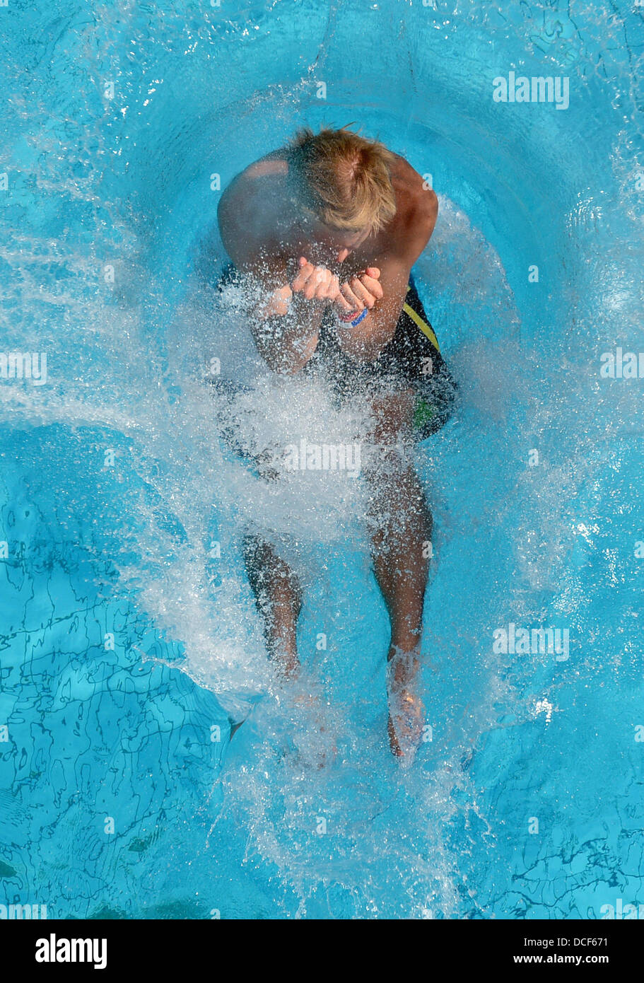 Berlin, Germany. 16th Aug, 2013. A participant takes a test jump during ...