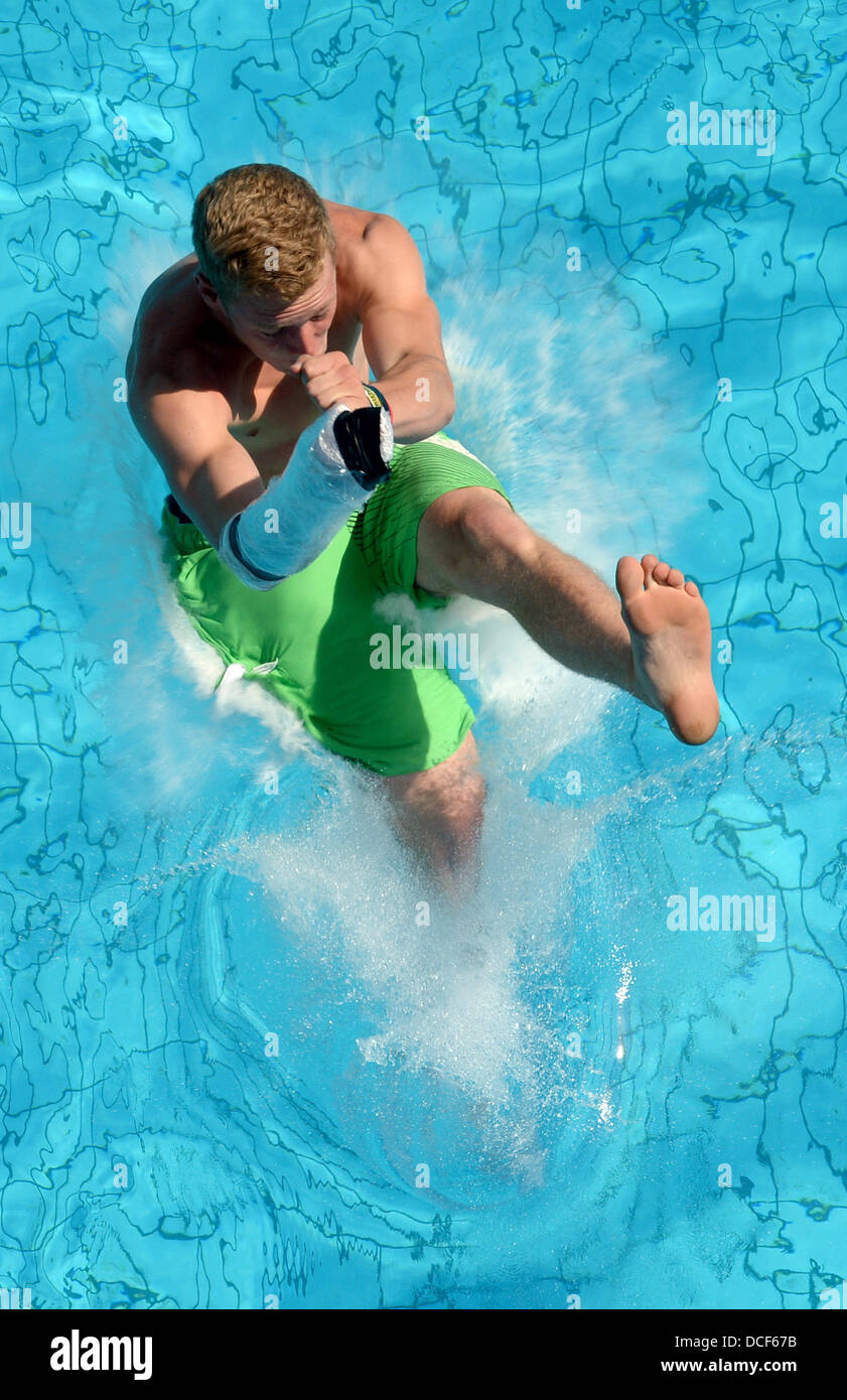 Berlin, Germany. 16th Aug, 2013. A participant takes a test jump during ...