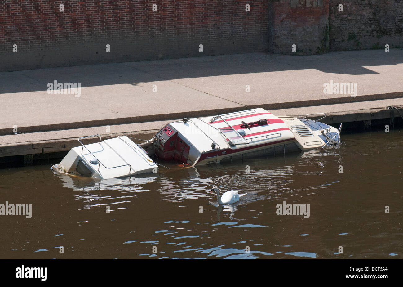 Sinking boat on river Thames at Hampton in Middlesex, England Stock ...