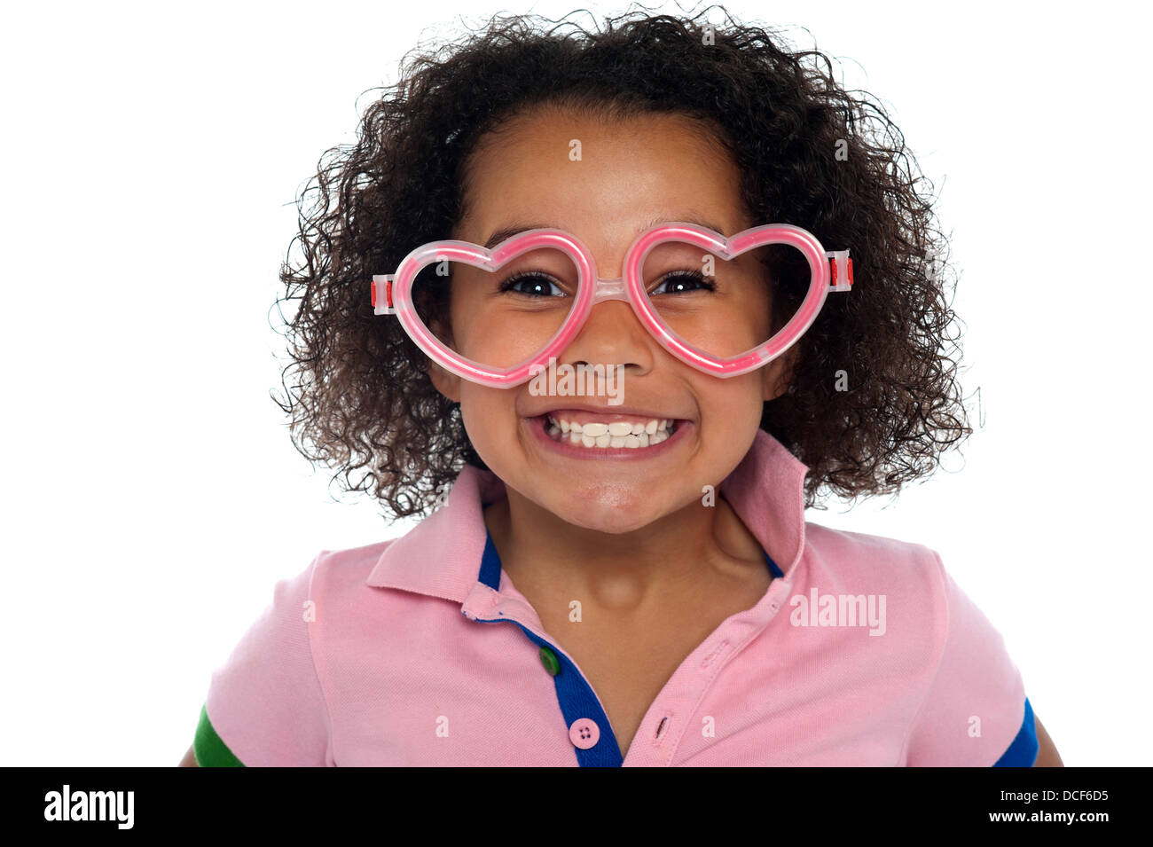 Pretty girl with a wide grin looking through heart shaped frame Stock ...
