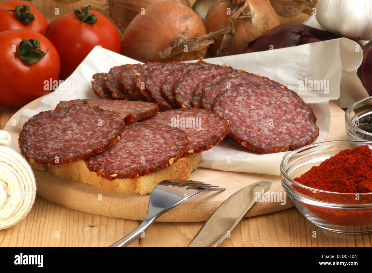 salami and some slices salami on a timber board Stock Photo - Alamy