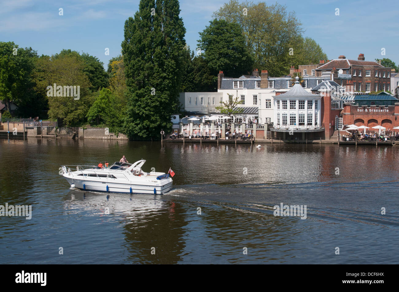 Boat on River Thames at Hampton Court, East Molesey in Middlesex with a ...