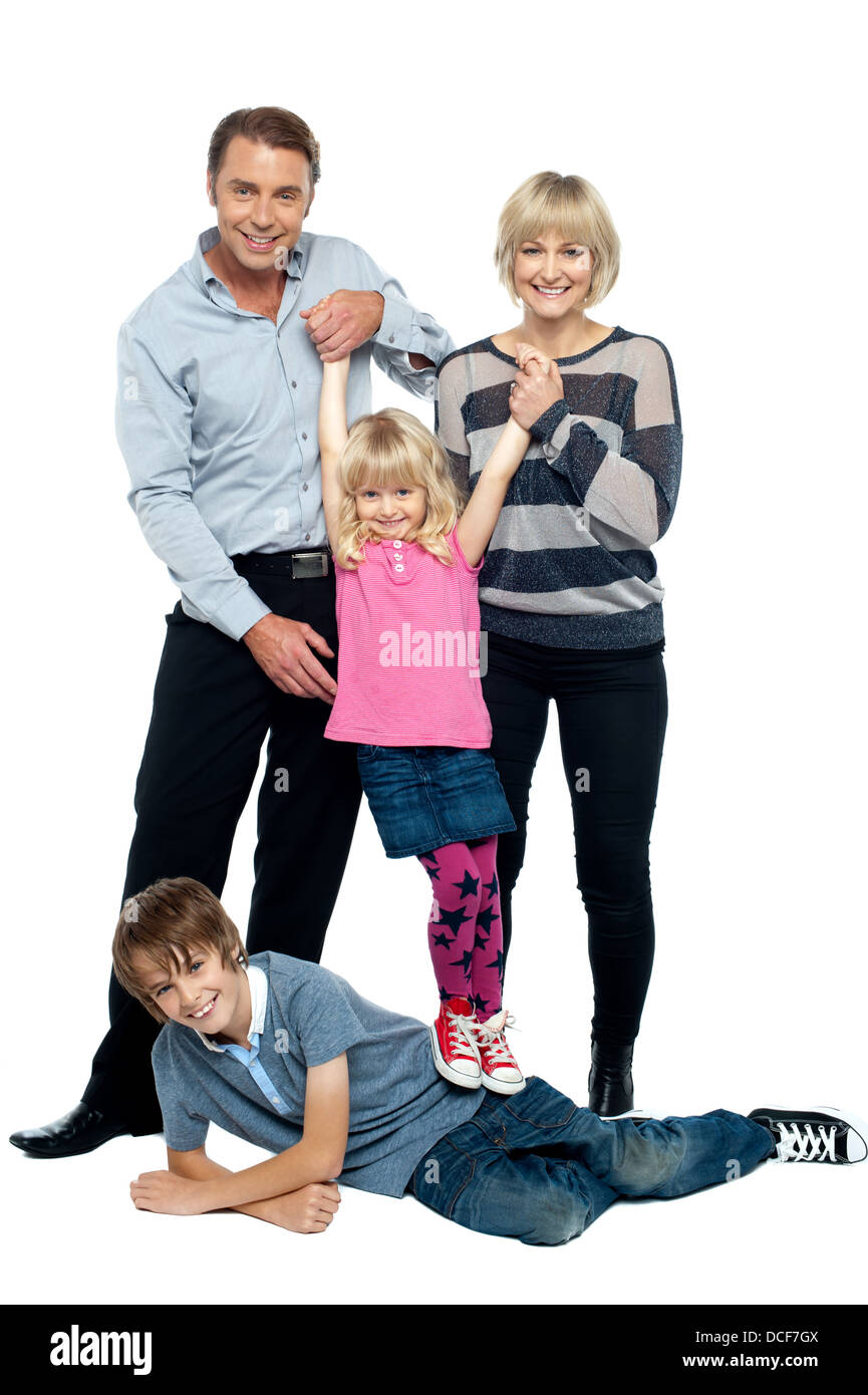 Happy family of four members on white background Stock Photo - Alamy