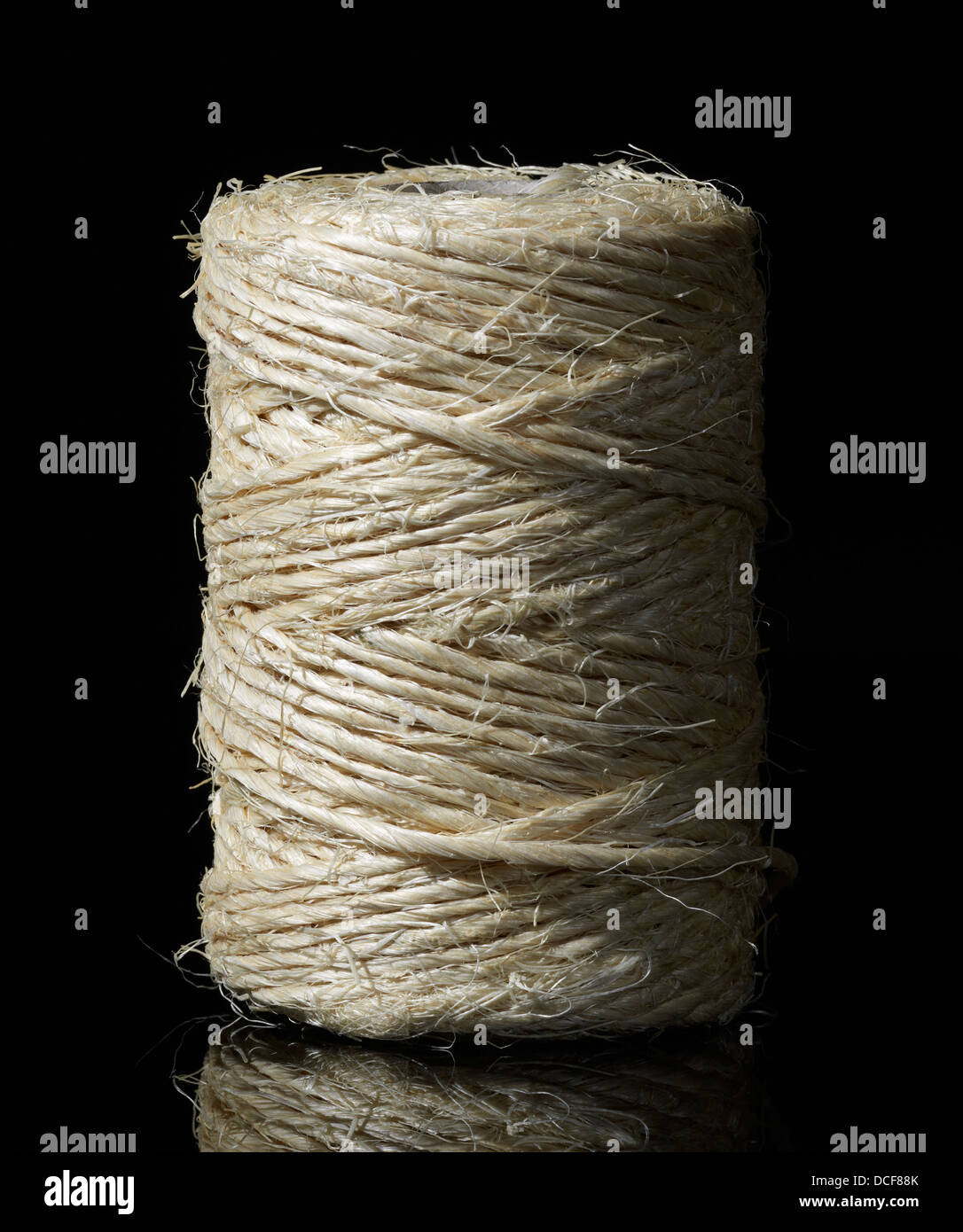 coin of yarn in dark back Stock Photo - Alamy