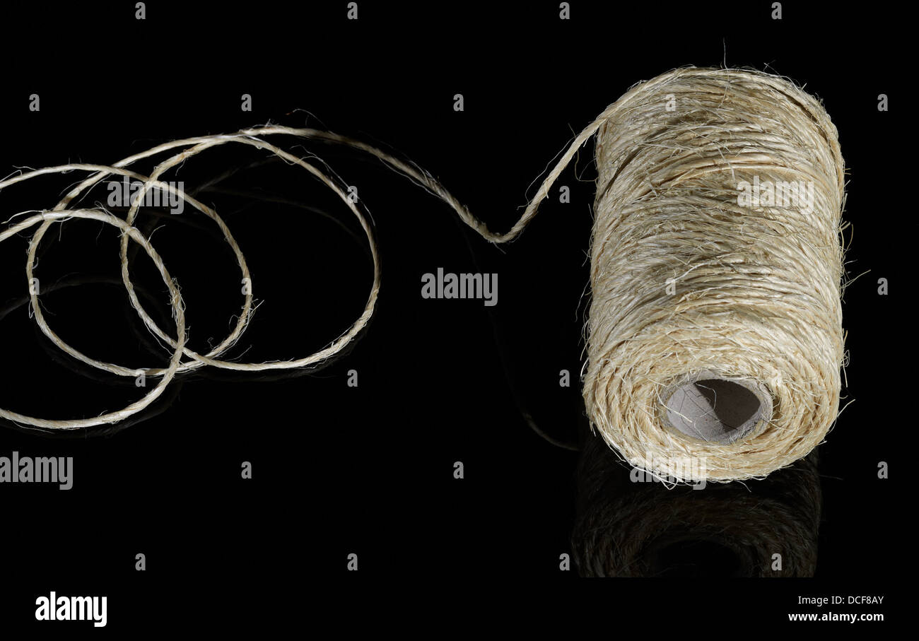 coin of yarn in dark back Stock Photo - Alamy