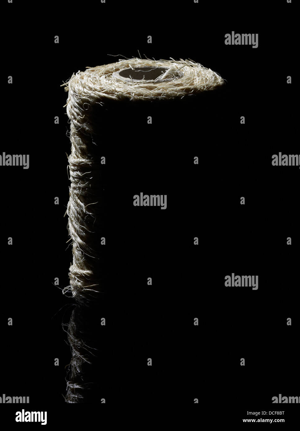 coin of yarn in dark back Stock Photo - Alamy
