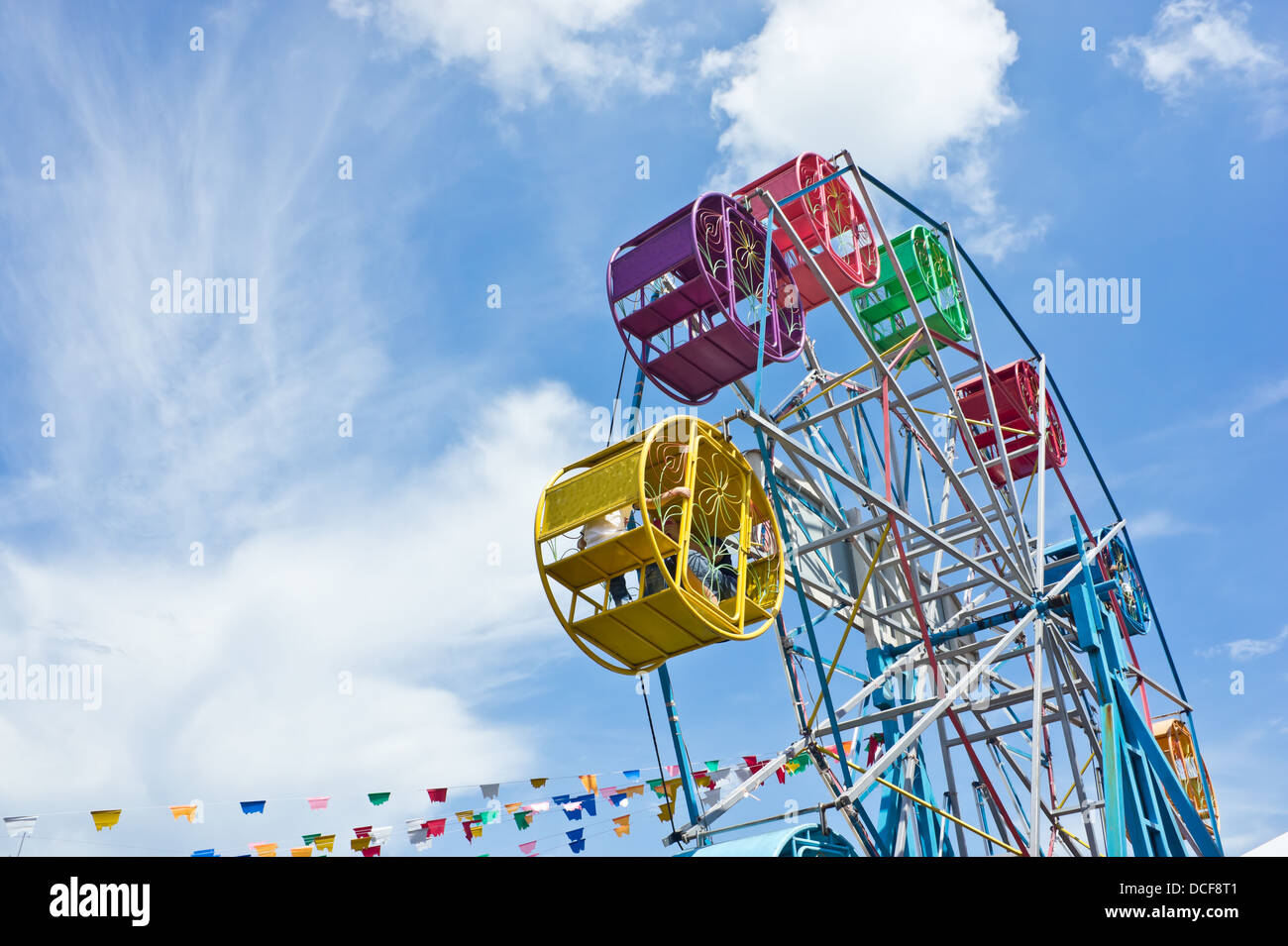 the colorful ferris wheel with blue sky background Stock Photo - Alamy